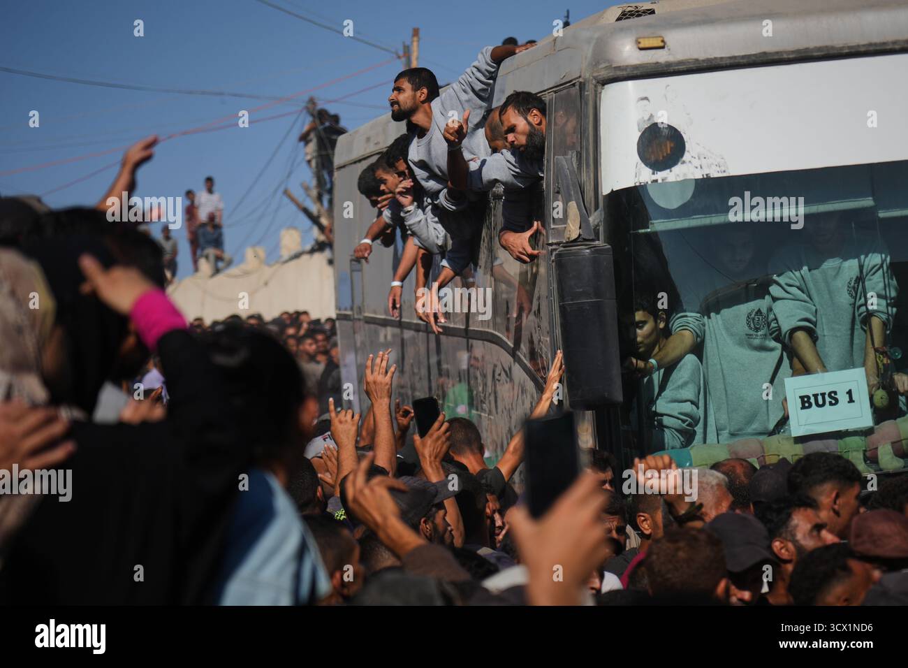People greet freed Palestinian prisoners arriving on buses in the Gaza ...