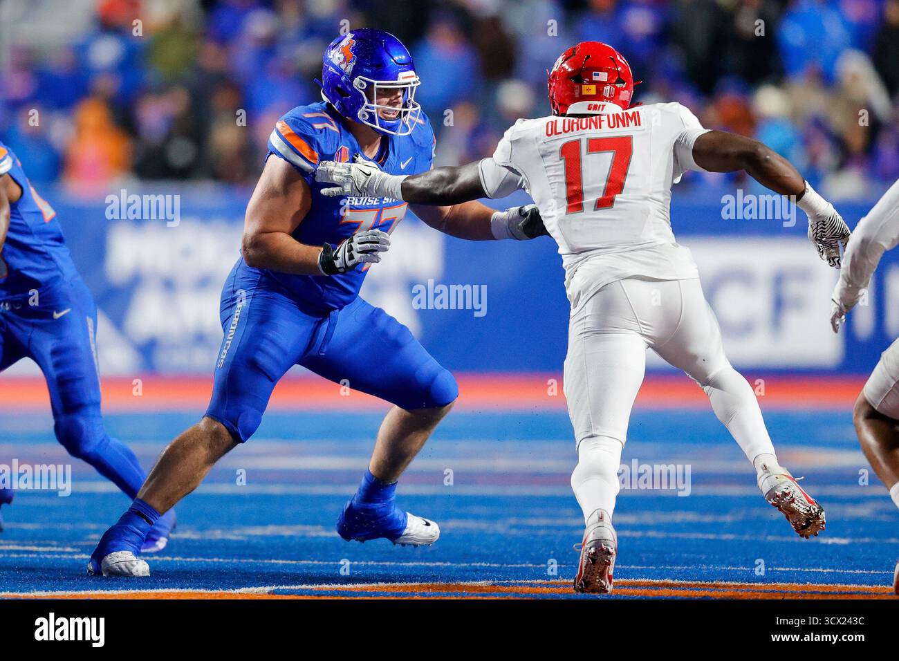 Boise State offensive lineman Kage Casey (77) works to block New Mexico ...