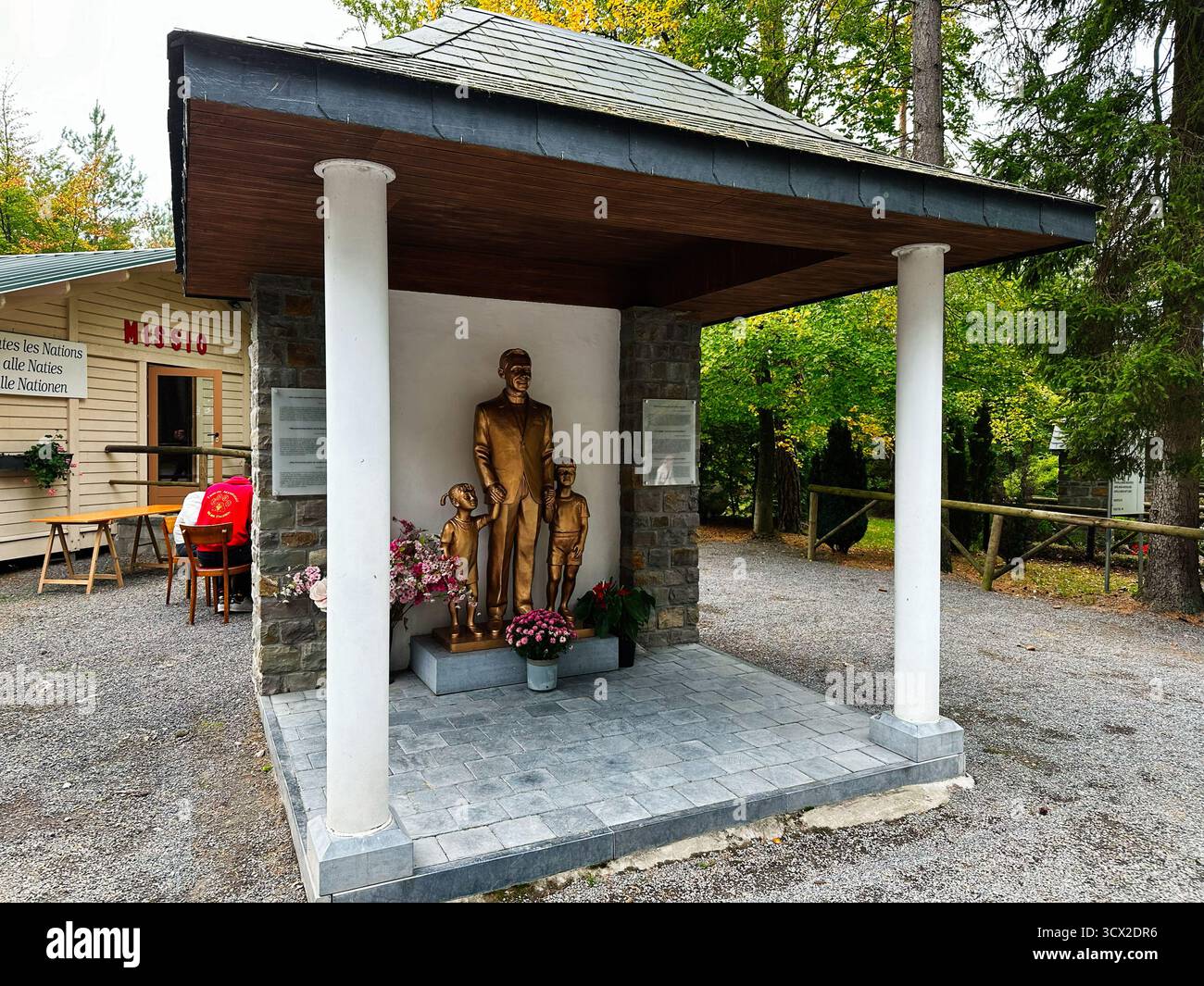 Banneux, Belgium - October 20, 2023: A bronze family statue under a ...
