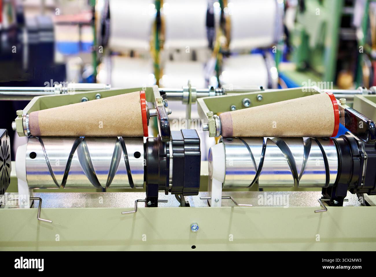 Bobbin to cone rewinding machine Stock Photo - Alamy