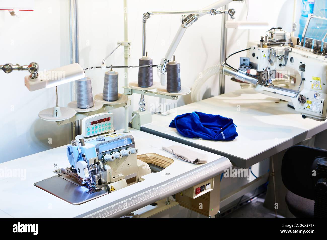 Industrial 4-thread overlock in workshop Stock Photo - Alamy