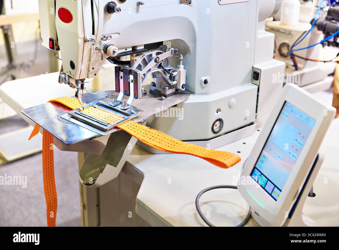 Programmable stitch sewing machine in workshop Stock Photo - Alamy