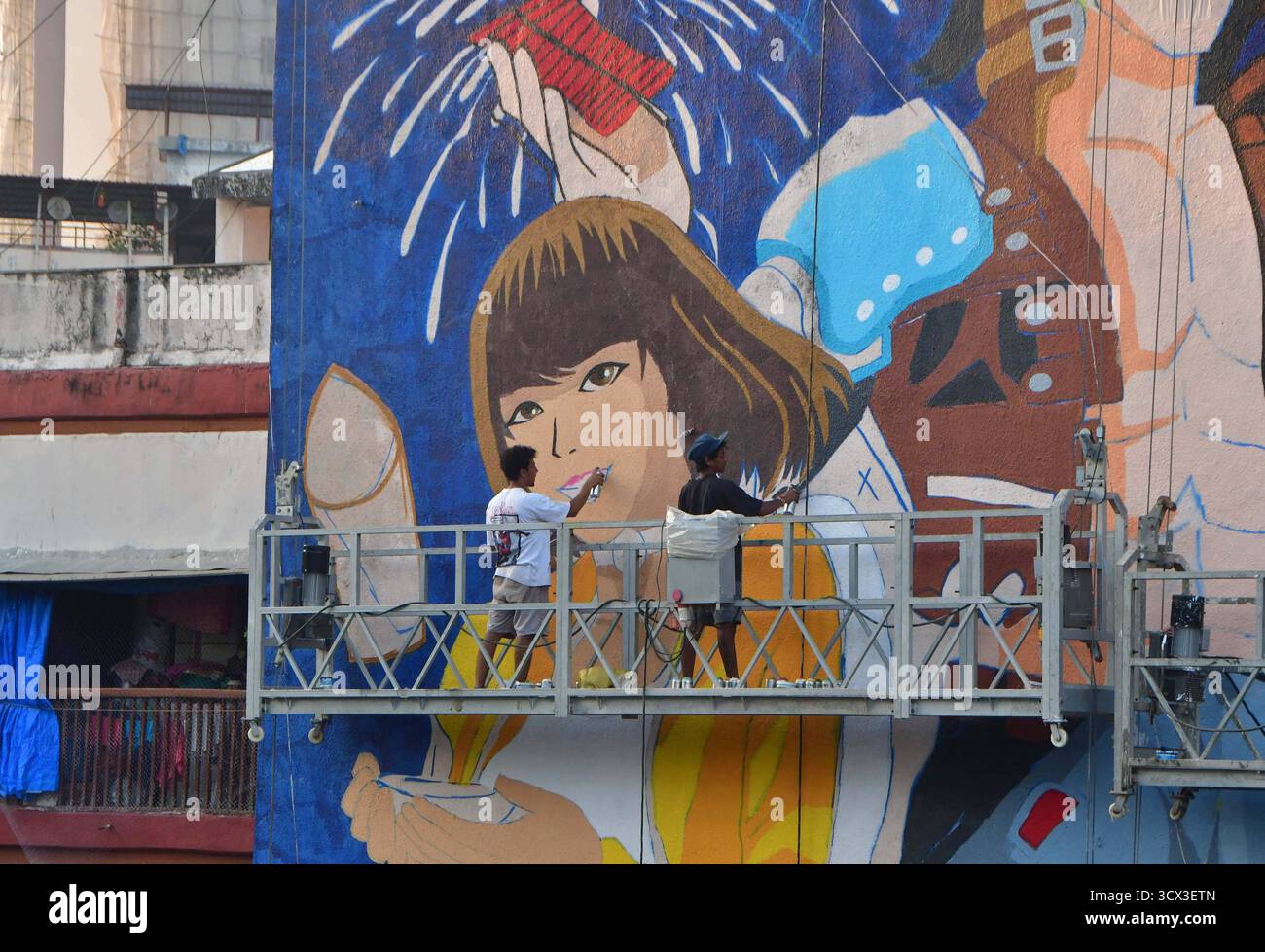 MUMBAI, INDIA - OCTOBER 13: Artisans create Diwali graffiti on a ...
