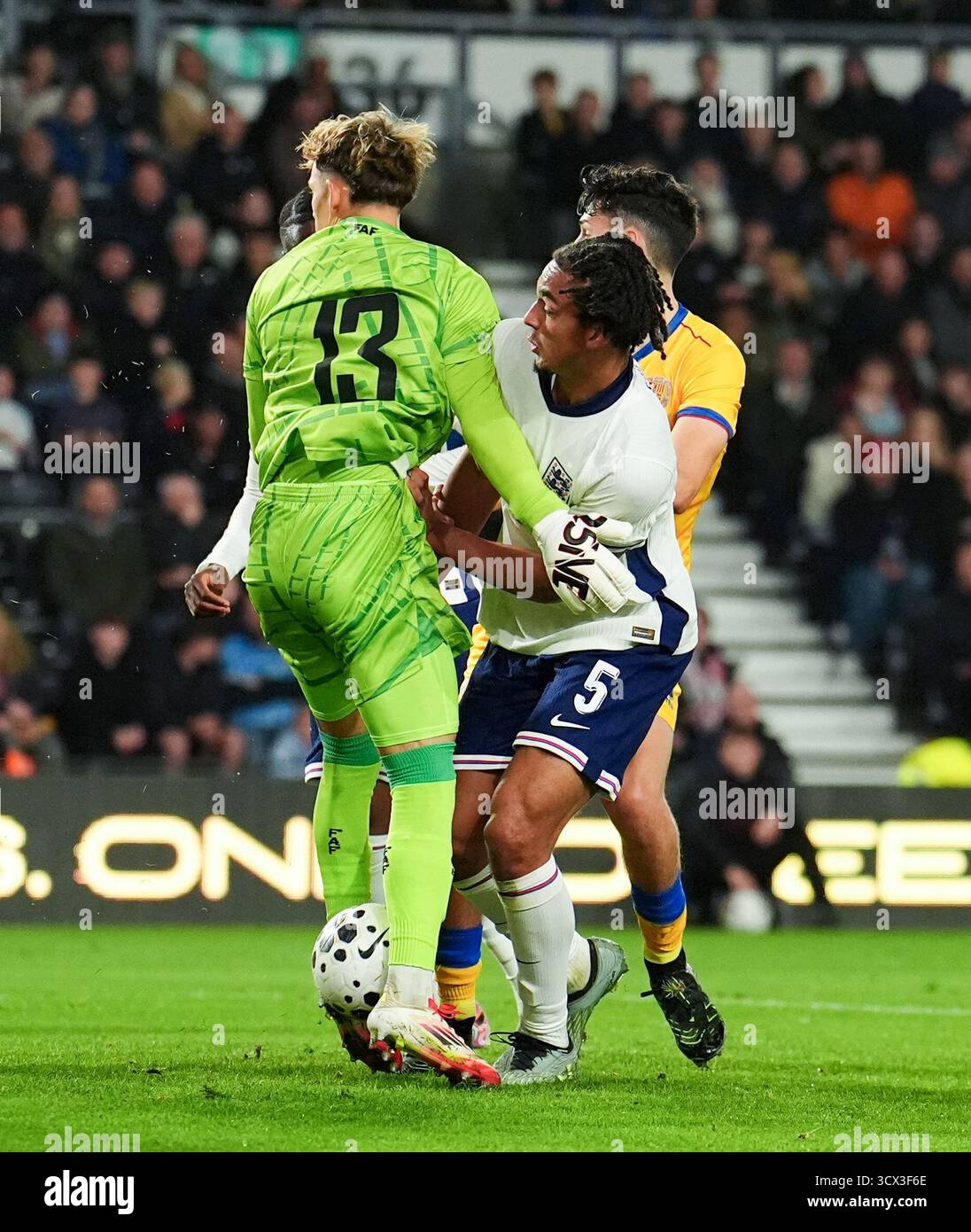 Andorra's Marc de Castro and England's Ashley Phillips battle for the ...