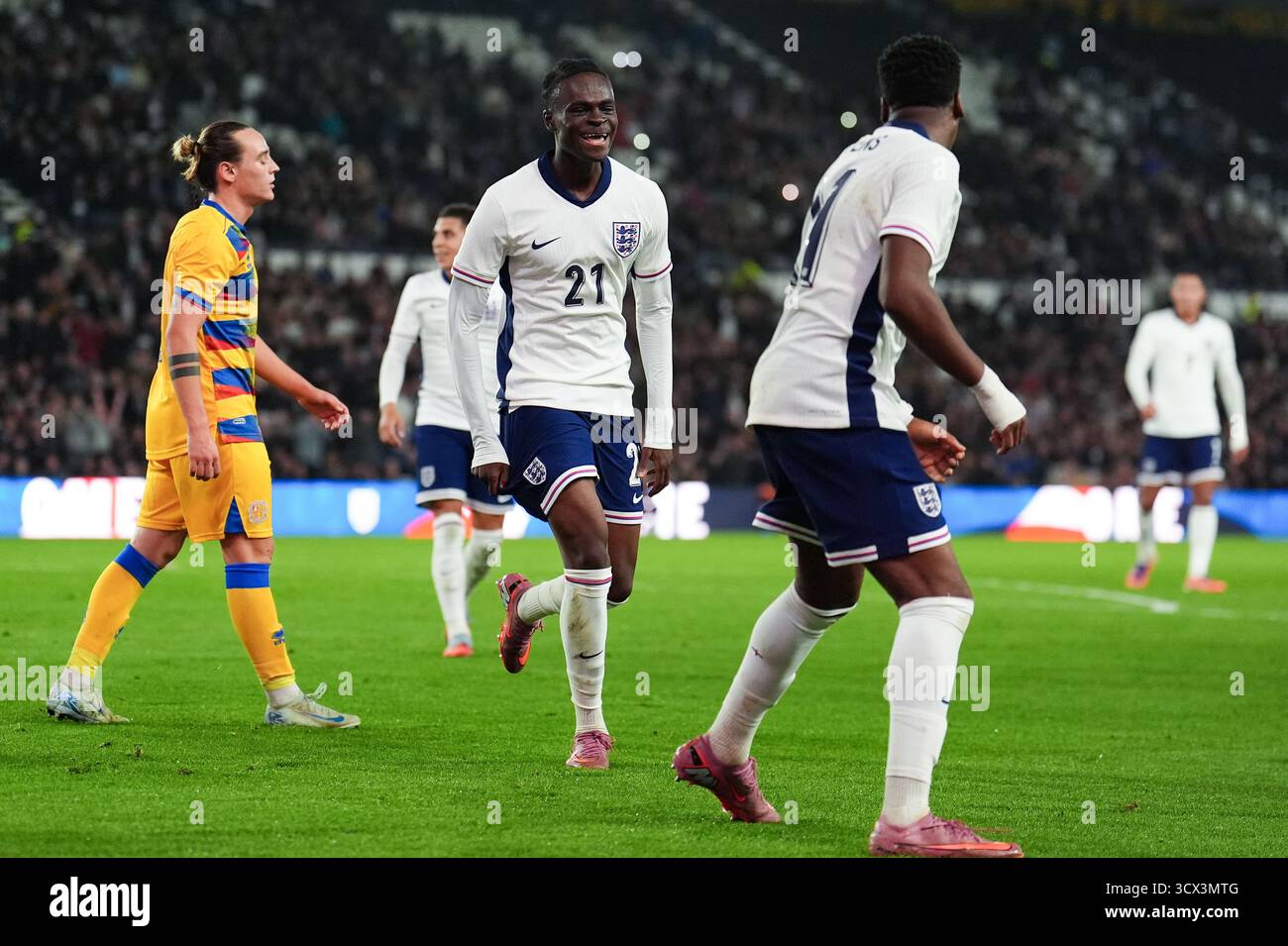 England's Tyrique George celebrates scoring their side's first goal of ...