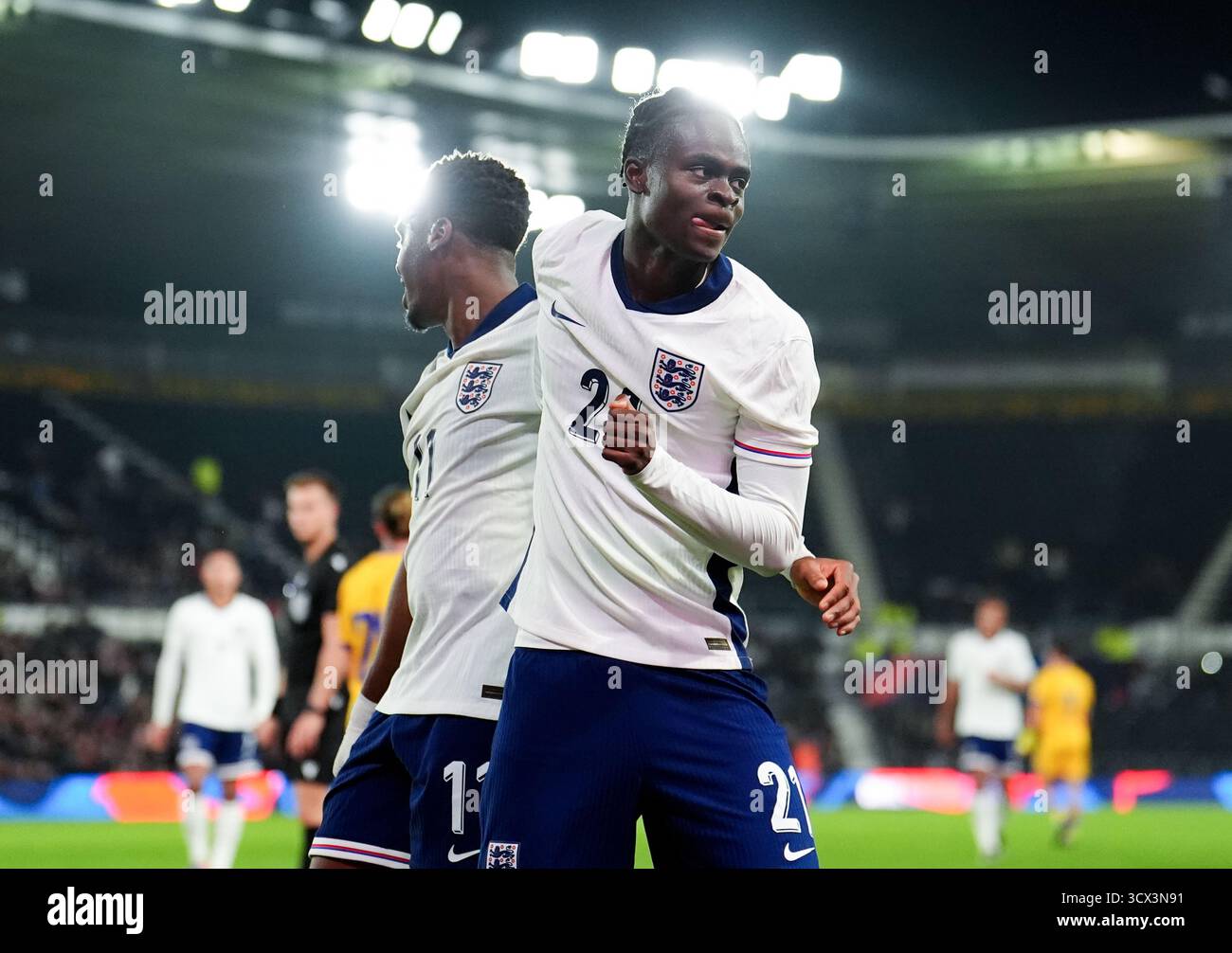 England's Tyrique George celebrates scoring their side's first goal of ...
