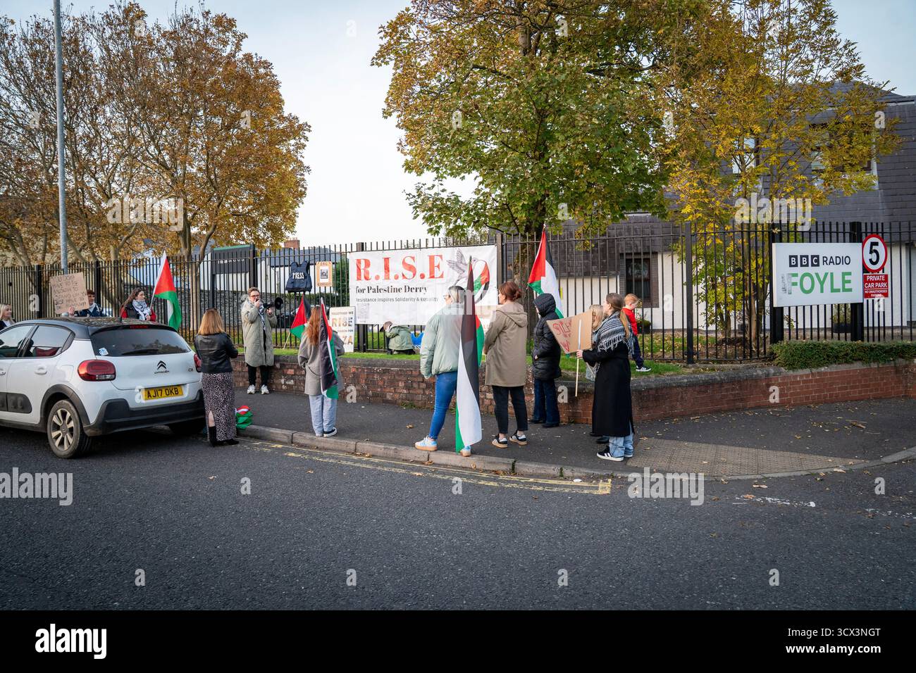 Derry, Northern Ireland. 13 October 2025. Demonstrators hold ...