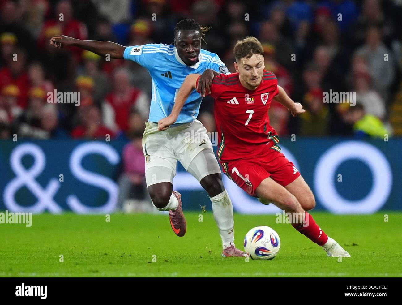 Belgium's Jeremy Doku (left) and Wales' David Brooks battle for the ...