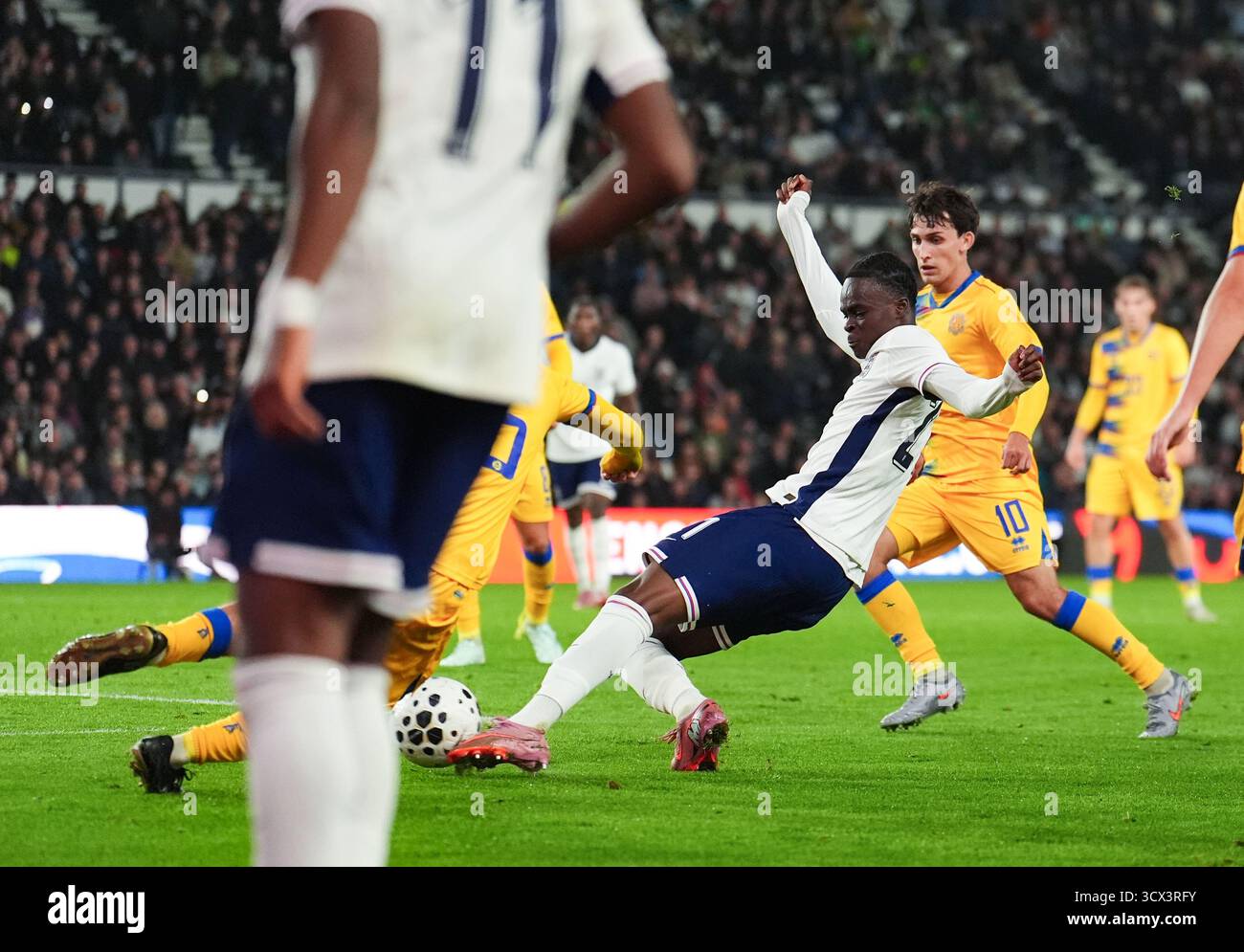 England's Tyrique George scores their side's first goal of the game ...