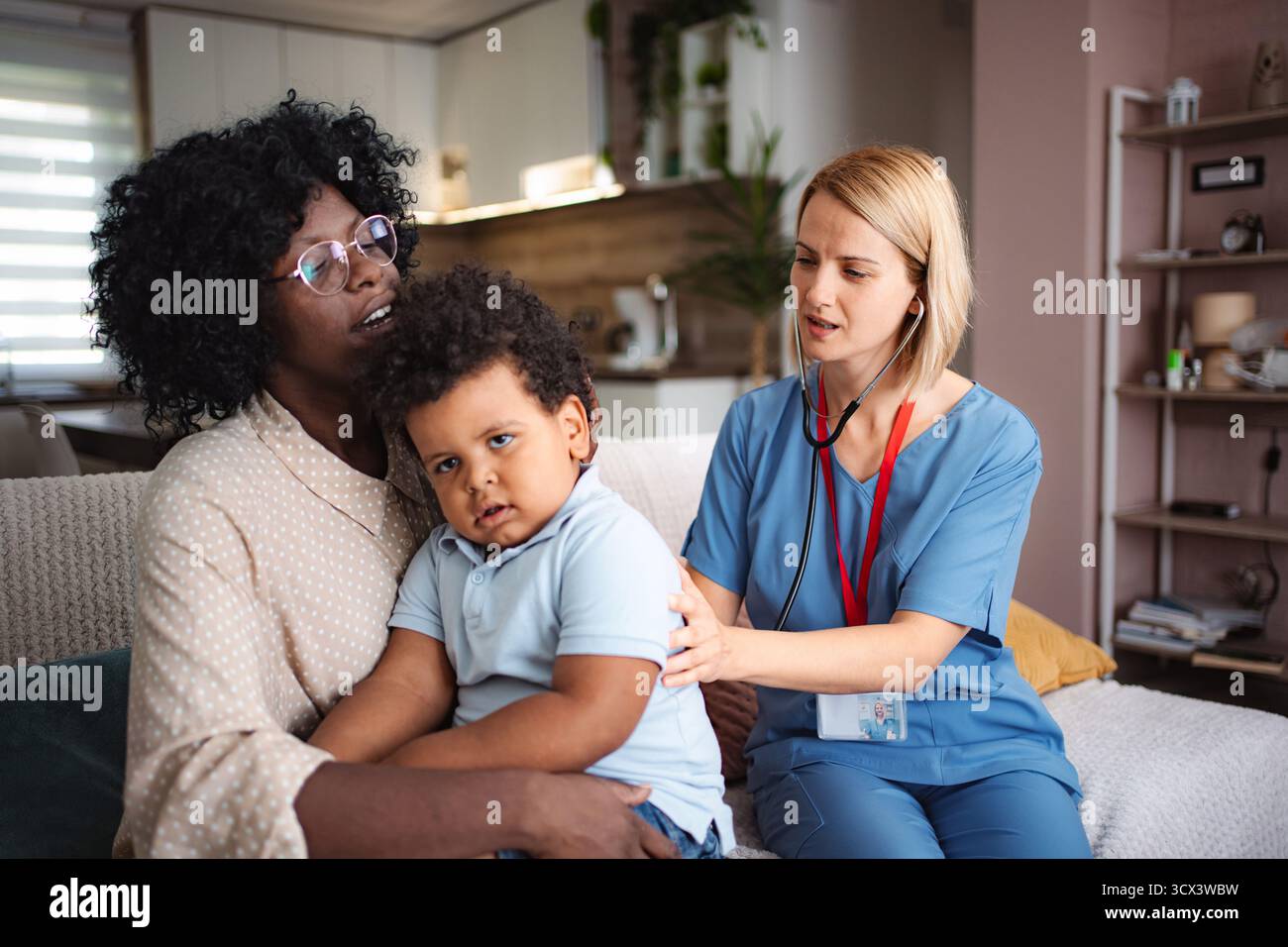 Pediatrician doctor examining child hi-res stock photography and images ...