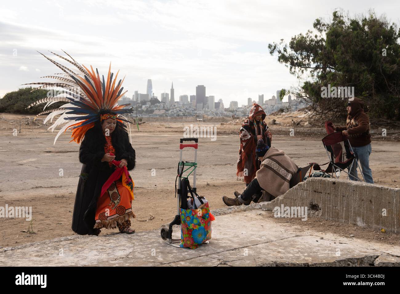 Aztec dancers prepare to leave after they attend a sunrise gathering ...