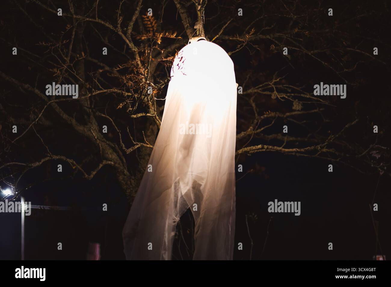 Spooky Halloween photo of a ghost figure in the dark with eerie ...