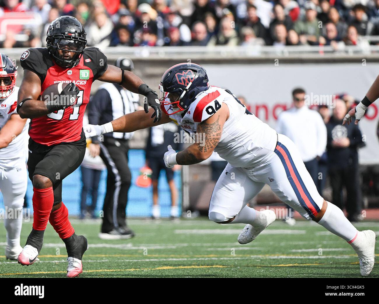 Ottawa Redblacks running back William Stanback, front left, breaks away ...