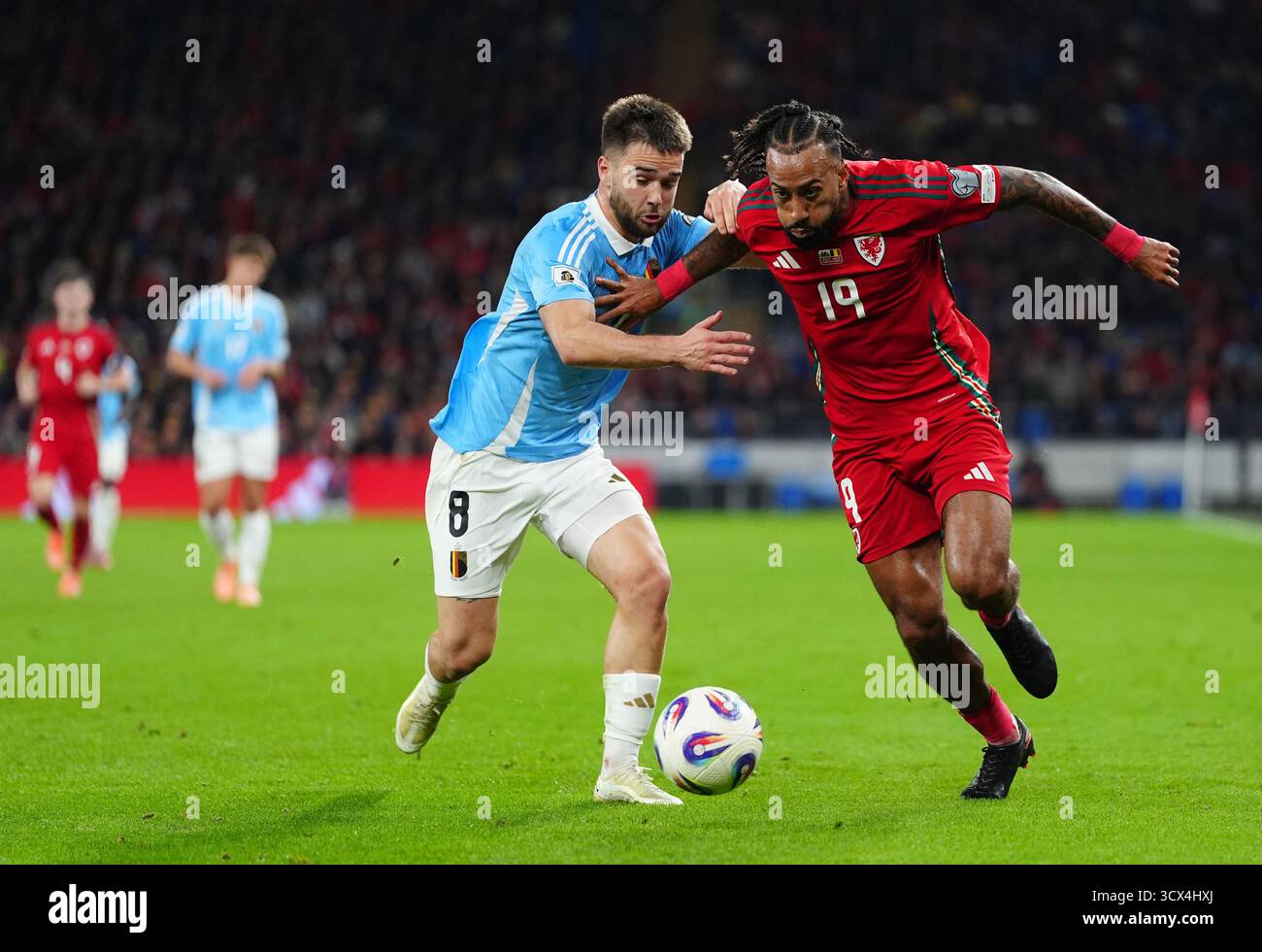 Belgium's Nicolas Raskin (left) and Wales' Sorba Thomas battle for the ...
