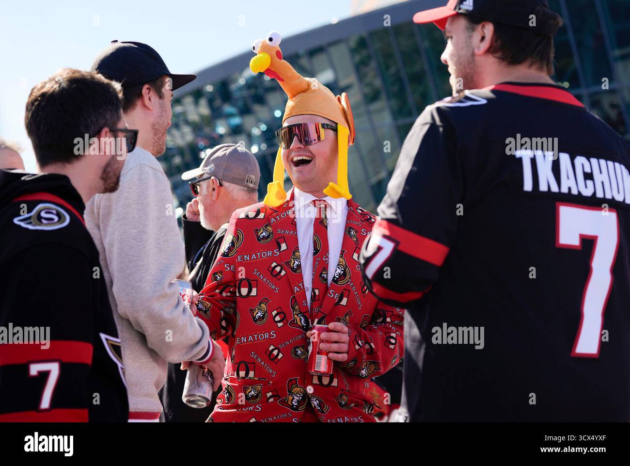Joey Schultz wears his Ottawa Senators suit with a turkey hat for ...