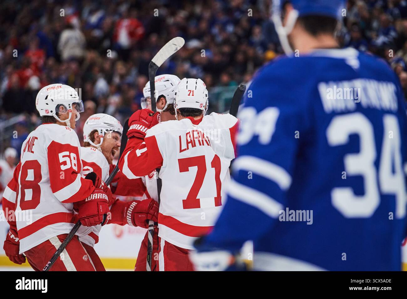 The Detroit Red Wings celebrate after the winning goal by Mason ...