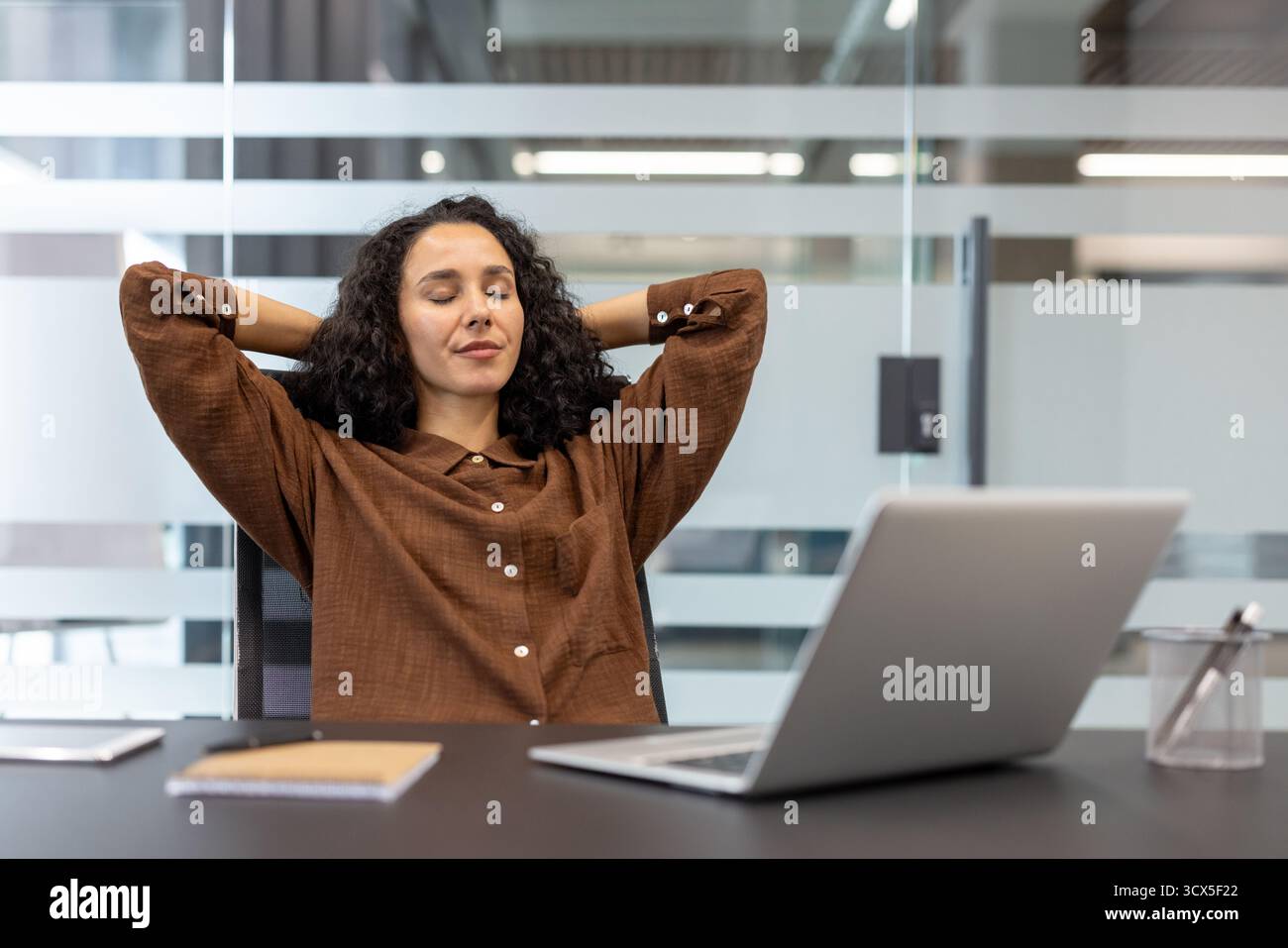 Focused indian woman leaning hi-res stock photography and images - Alamy