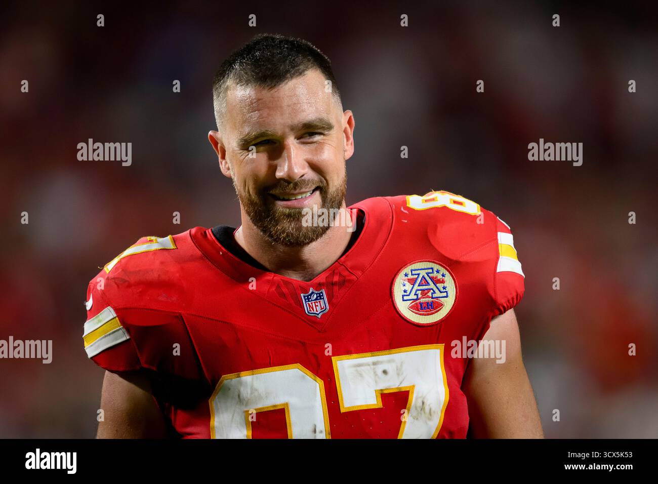 Kansas City Chiefs tight end Travis Kelce walks back to the huddle ...