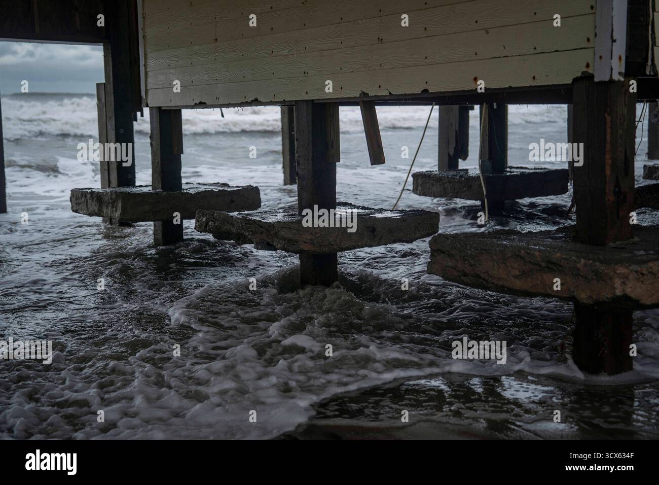 Concrete is visible at the bottom of a home after a storm, Monday, Oct ...