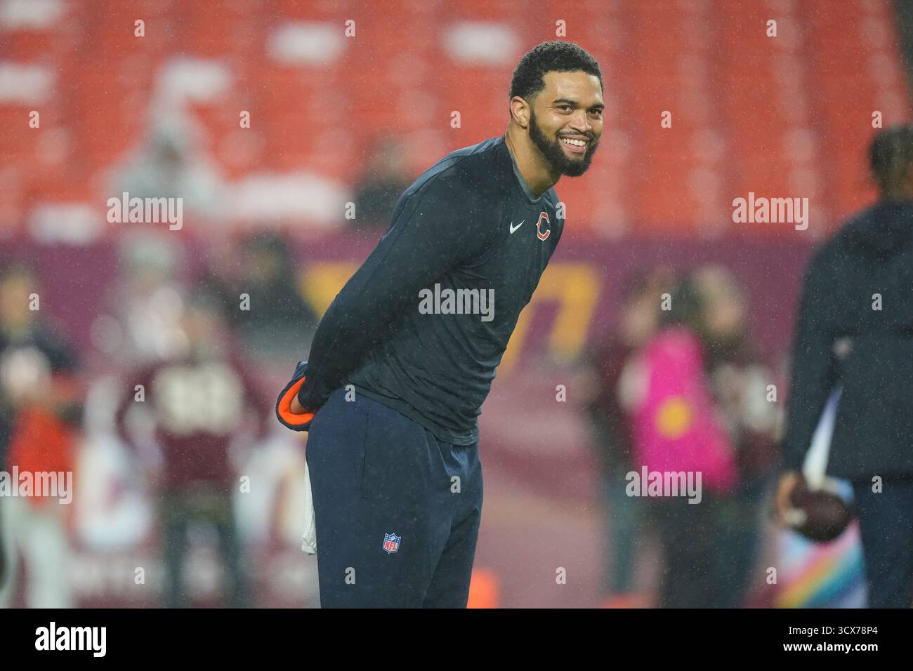 Chicago Bears quarterback Caleb Williams smiles as he warms up before ...
