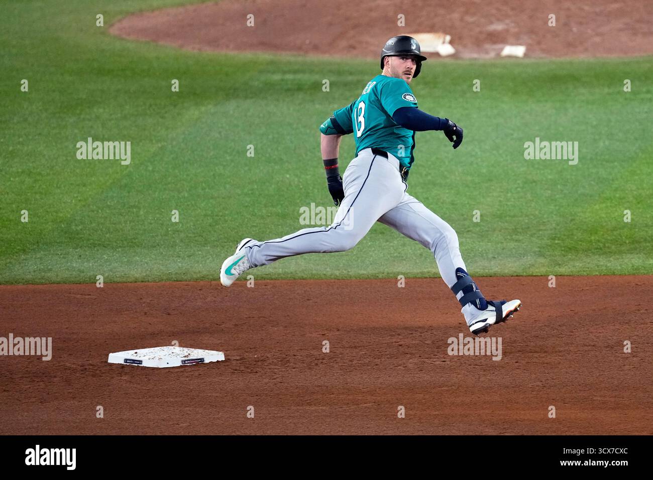 Seattle Mariners' Mitch Garver runs out a pinch hit triple against the ...