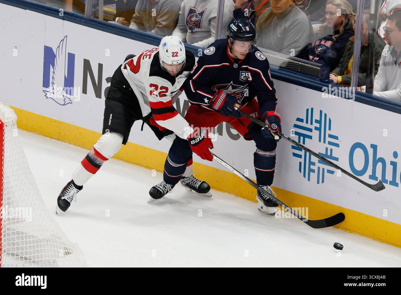 New Jersey Devils' Brett Pesce, left, and Columbus Blue Jackets' Zach ...