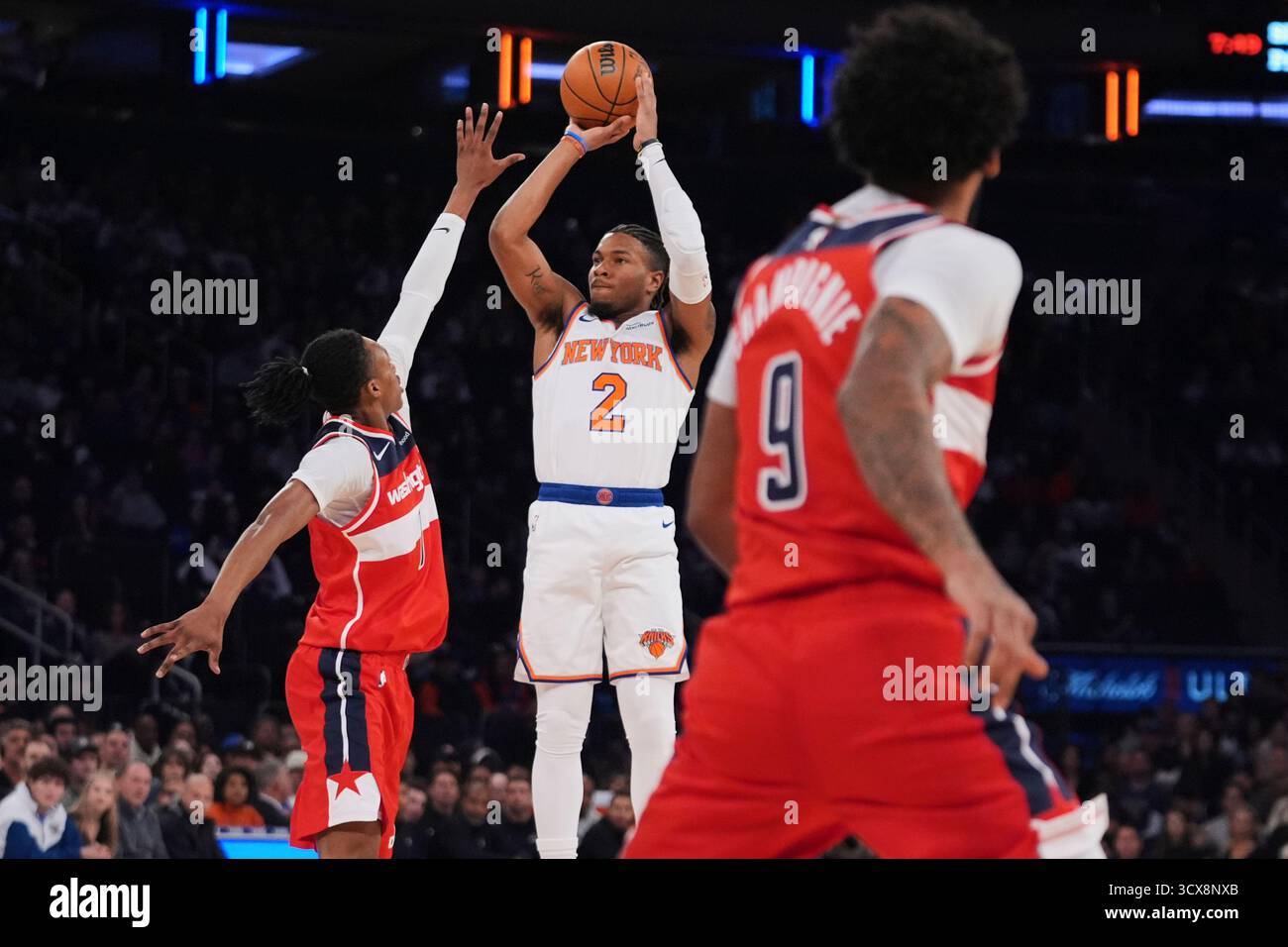 New York Knicks' Miles McBride (2) shoots over Washington Wizards' Cam ...