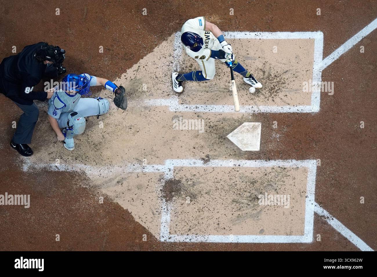 Milwaukee Brewers' Caleb Durbin hits a single during the third inning ...