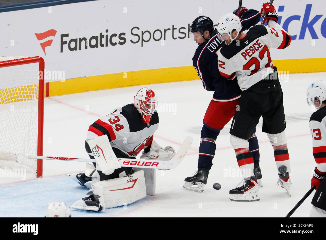 New Jersey Devils' Jake Allen, left, makes a save as teammate Brett ...