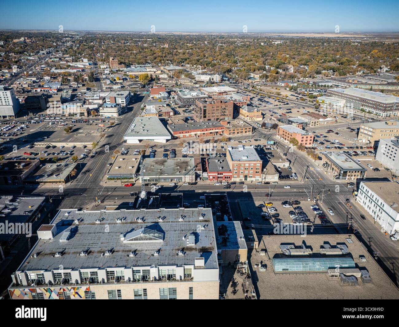 Aerial view of downtown Saskatoon, Saskatchewan, with fall colors along ...