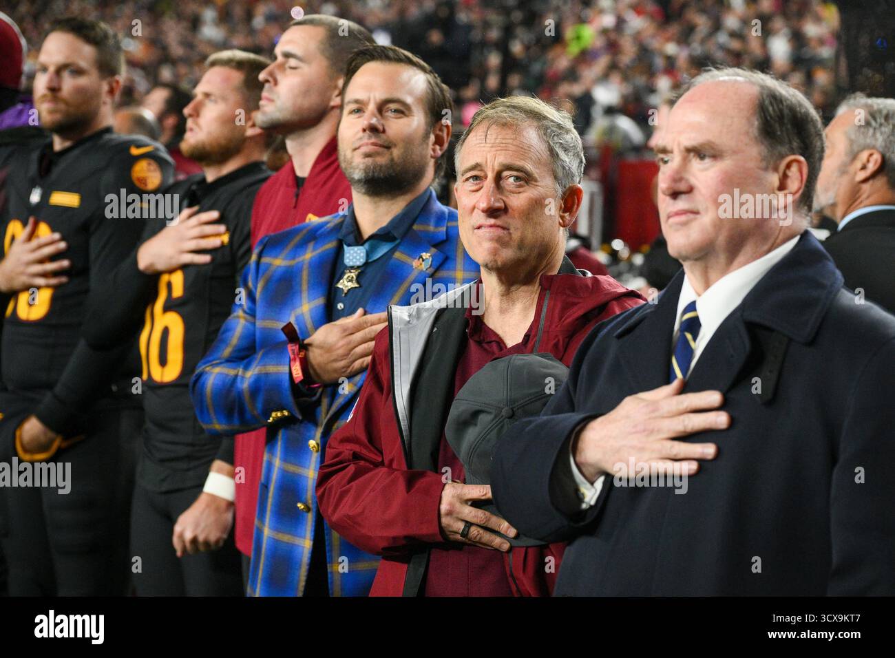 Washington Commanders owner Josh Harris, second from right, stands ...