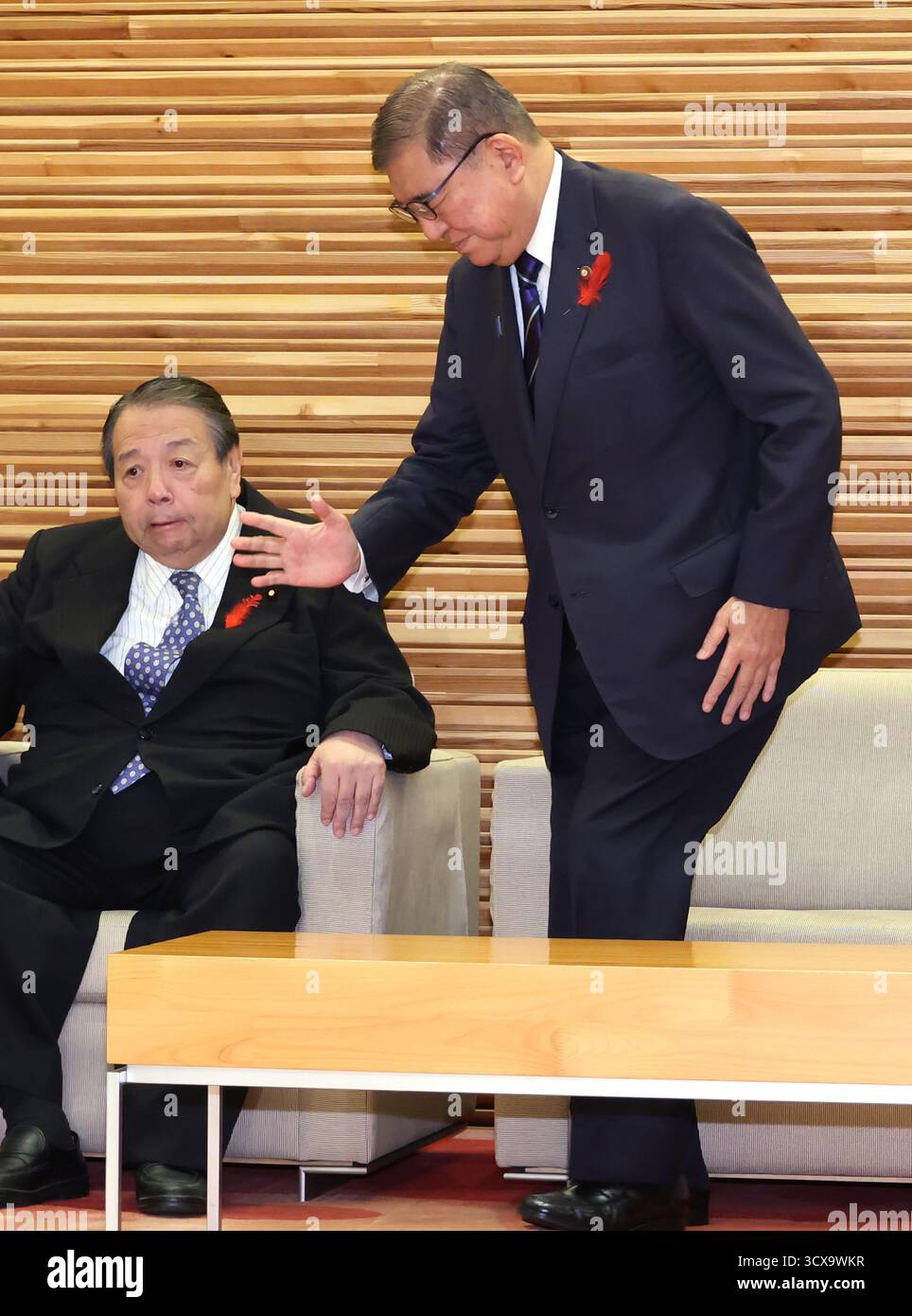 Japanese Prime Minister Shigeru Ishiba (R) and Internal Affairs and Communications Minister ...