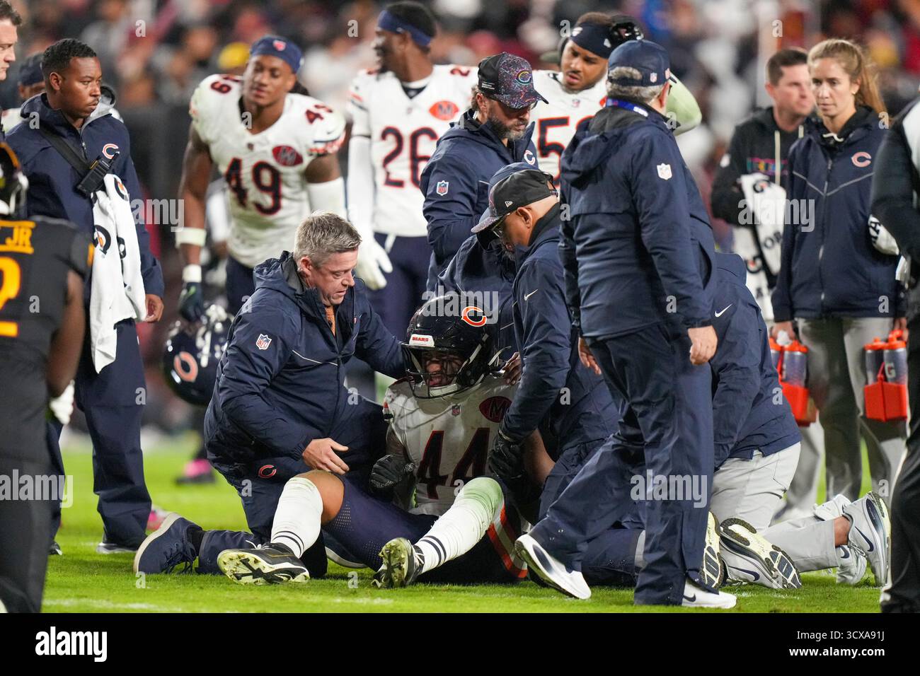Chicago Bears linebacker Noah Sewell (44) is helped after an injury ...