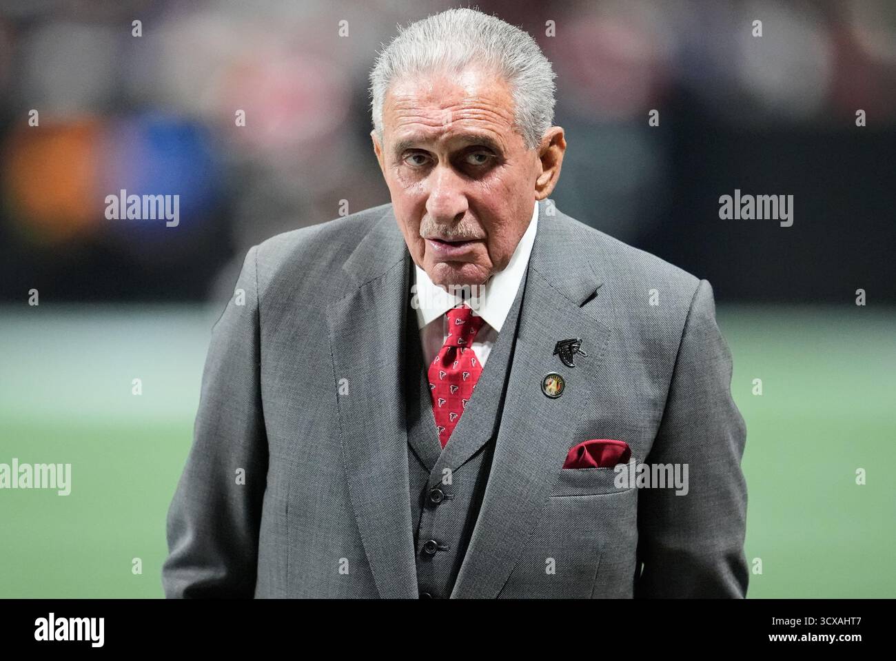 Atlanta Falcons owner Arthur Blank walks on the field during the second ...