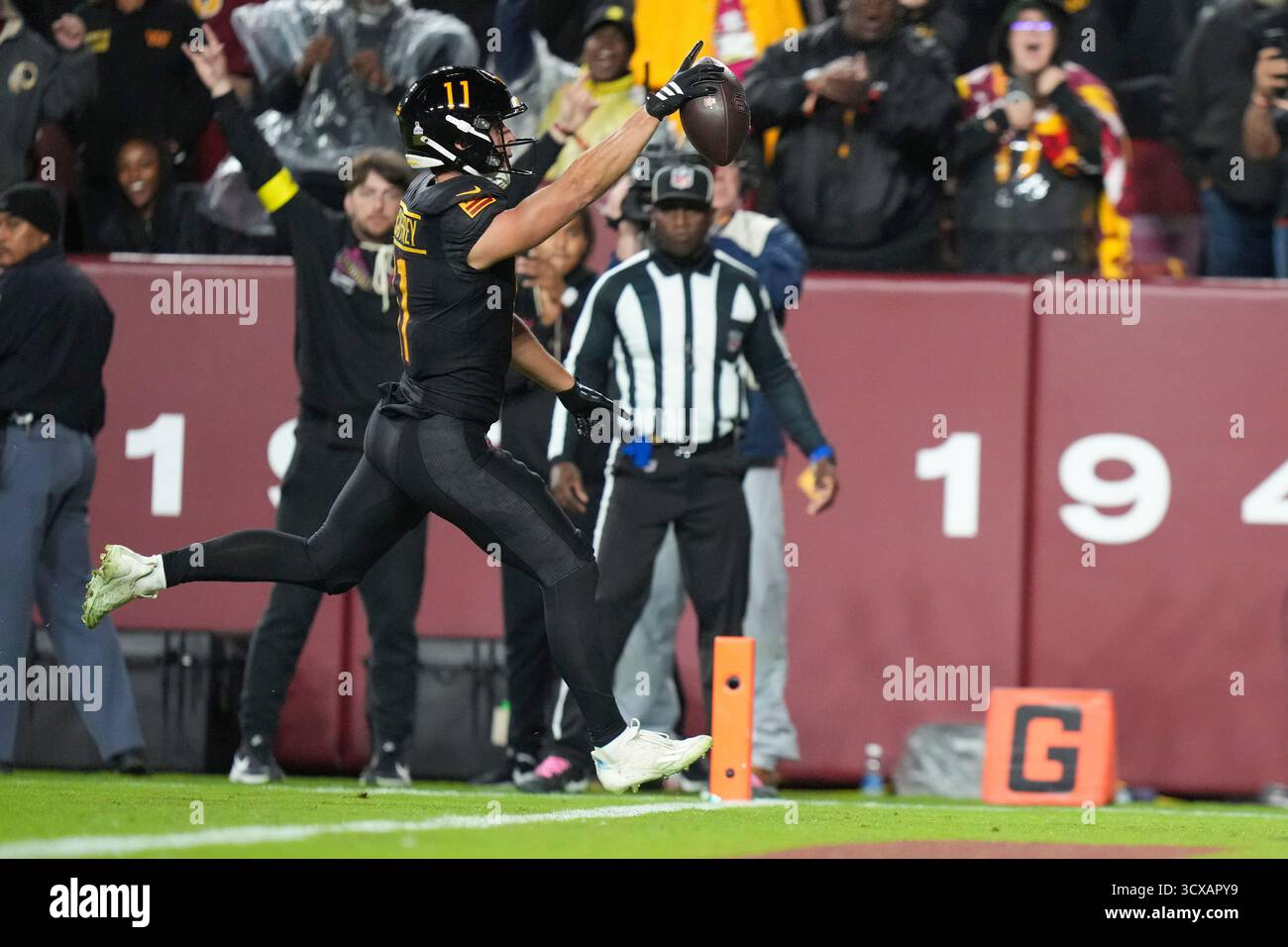 Washington Commanders wide receiver Luke McCaffrey runs with his ...