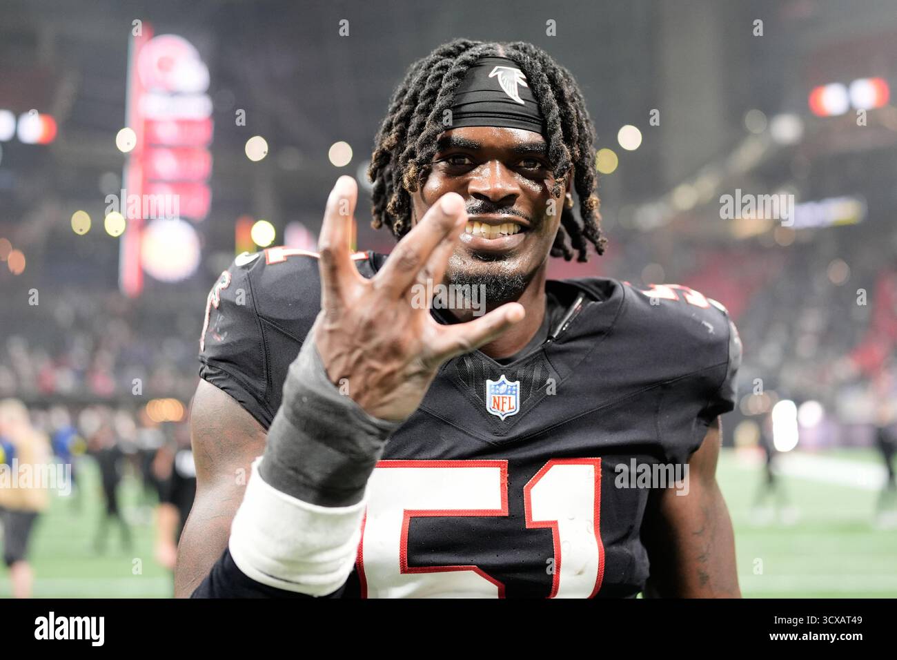 Atlanta Falcons linebacker Deangelo Malone (51) smiles as he walks off ...