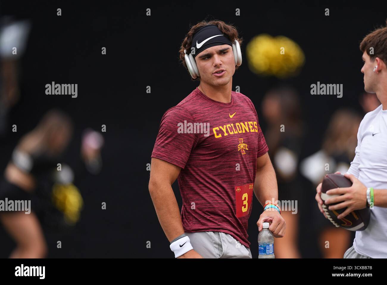 Iowa State quarterback Rocco Becht (3) warms up before an NCAA college ...