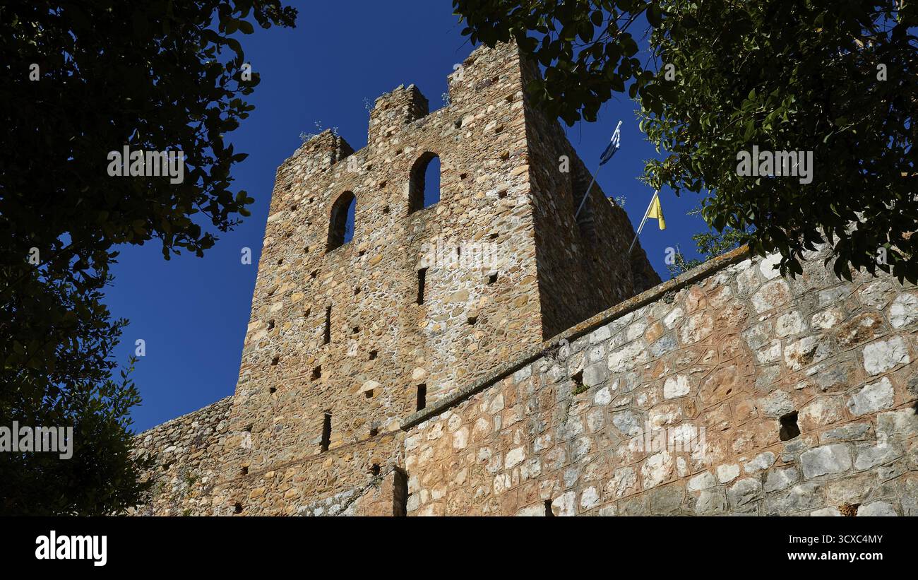 Lower main entrance, Mighty stone watchtower with flags on an ancient ...