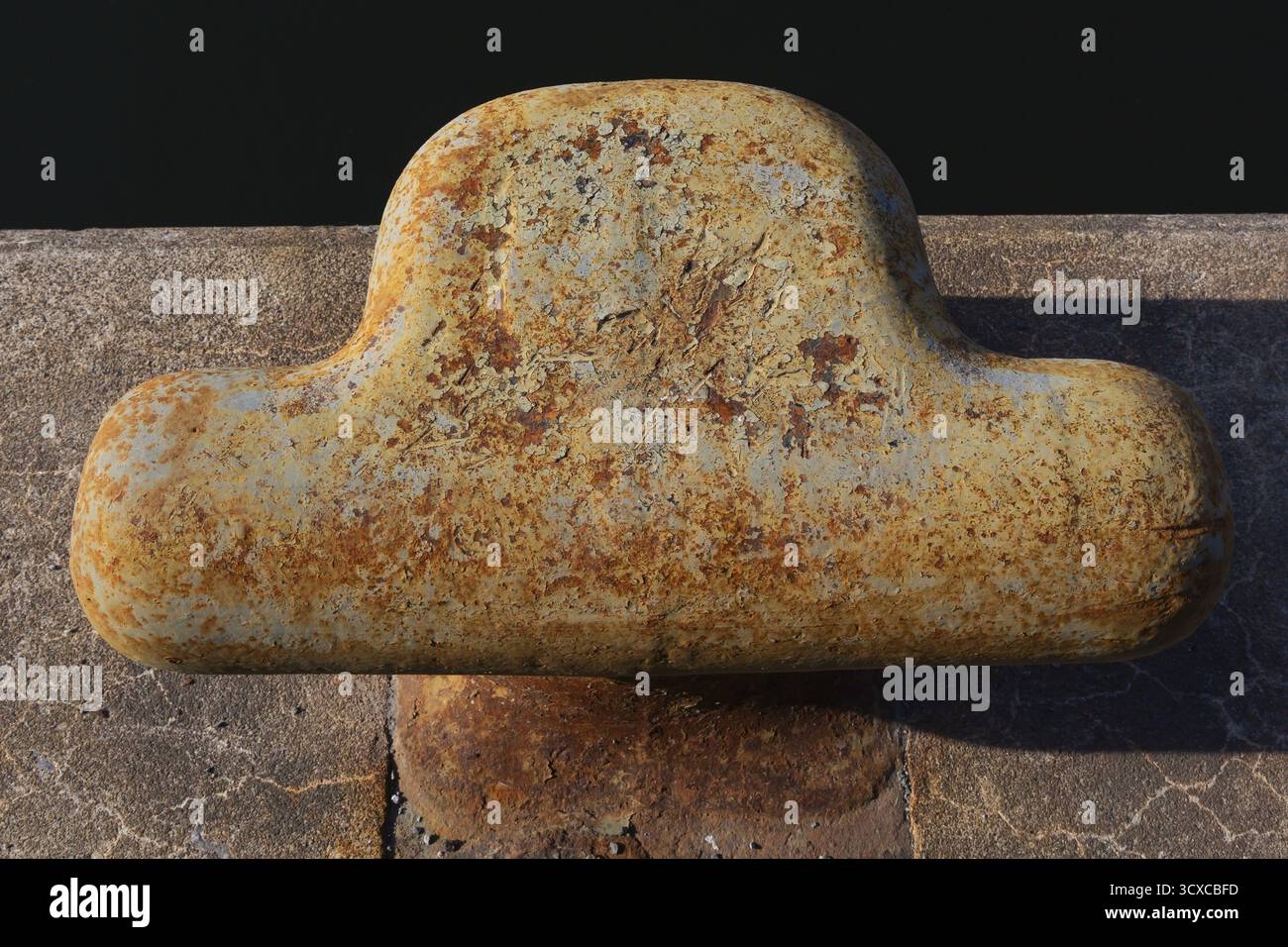 Close-up of bollard with flaking paint and rust spots on King Edward ...