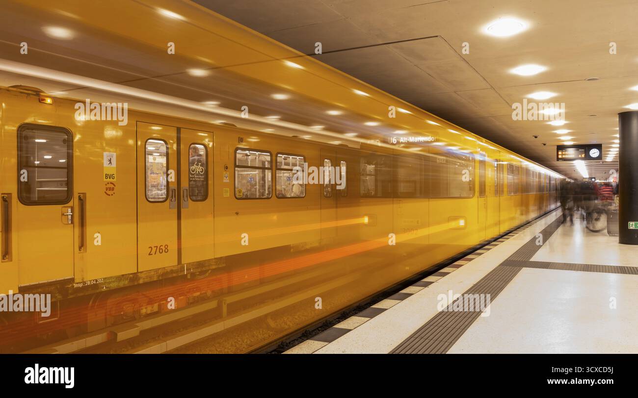 Dynamic scene of a Berlin underground in typical yellow colour, long ...