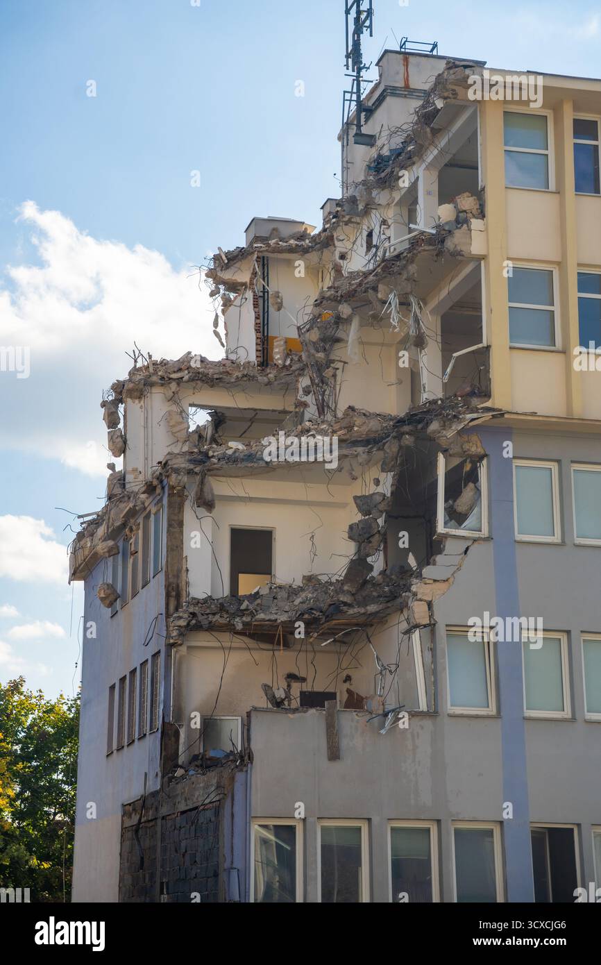 Partially demolished office building with exposed floors, walls and ...