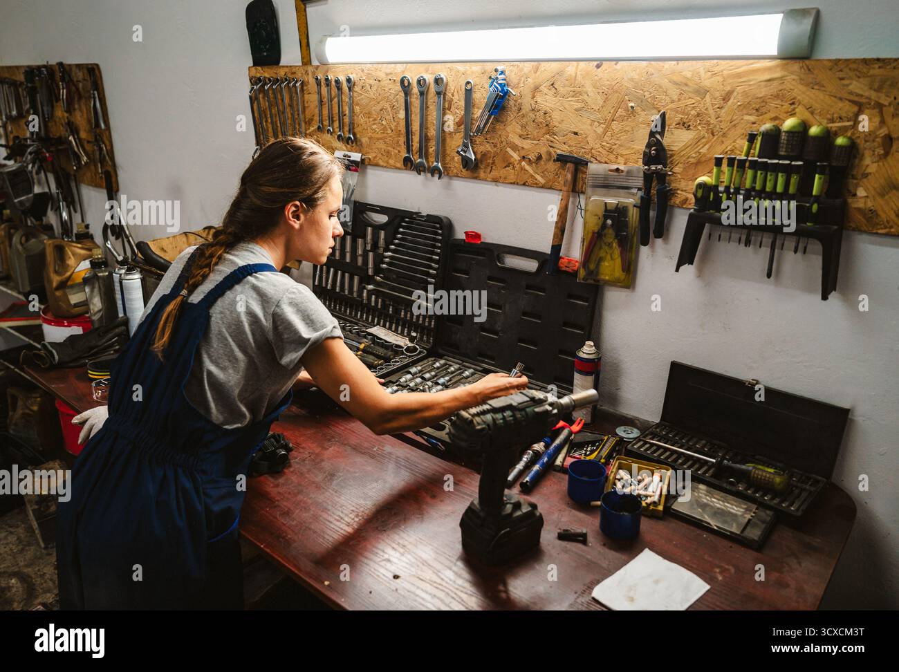Woman organizing workspace in hi-res stock photography and images - Alamy