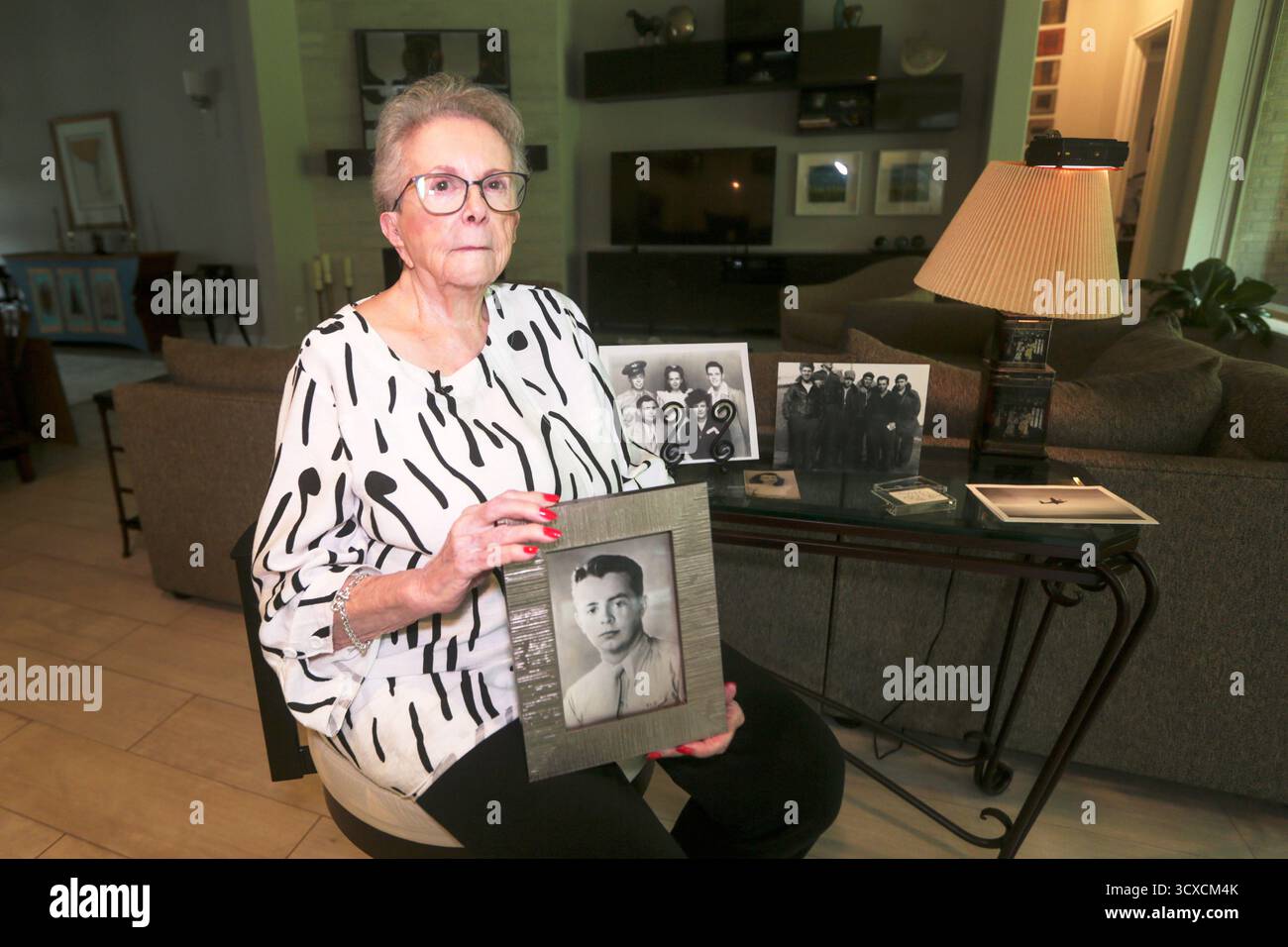 FILE - June West Brandt, 93, holds a photo displaying her brother ...