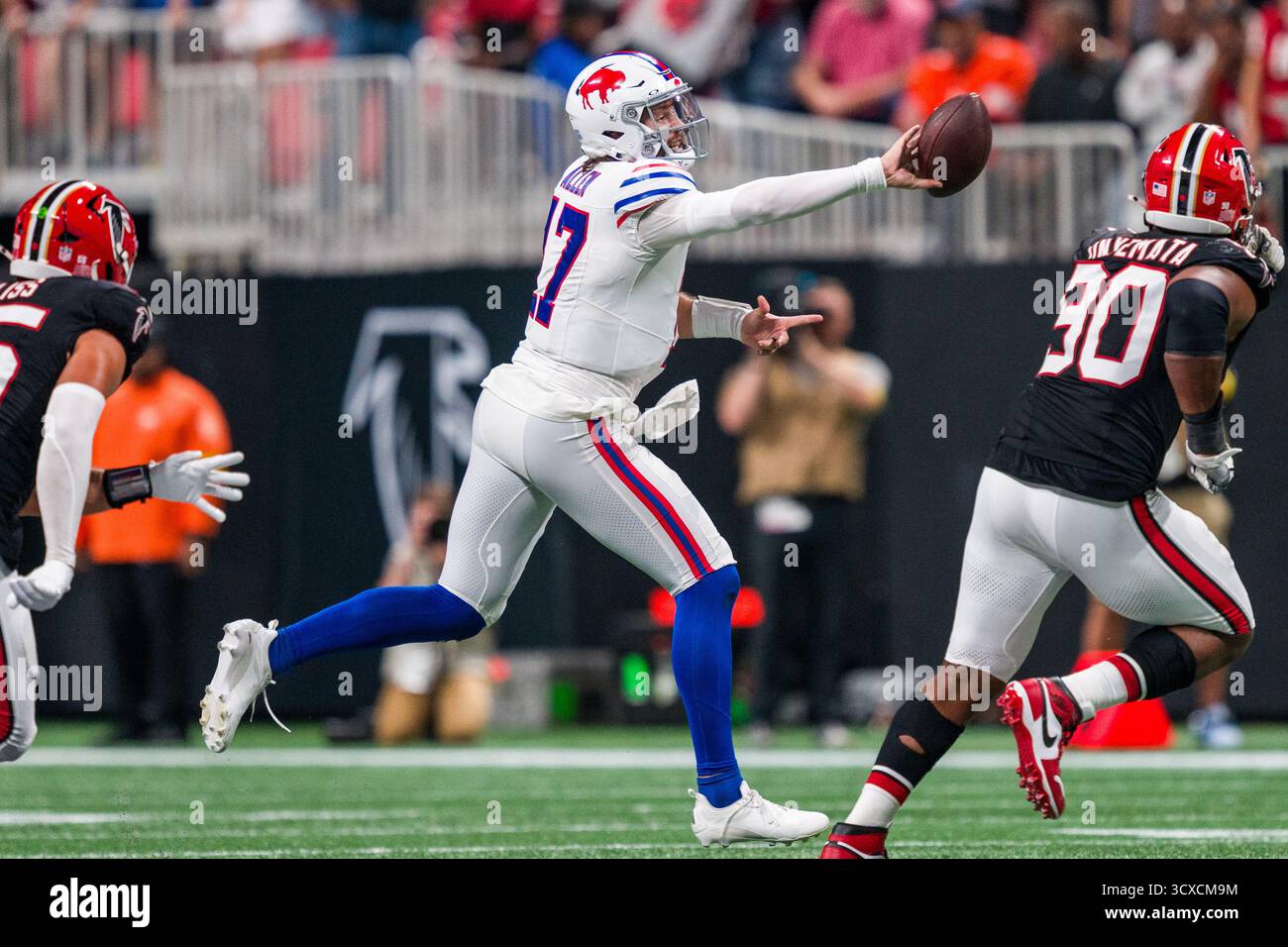 Buffalo Bills quarterback Josh Allen (17) throws a shovel pass during ...