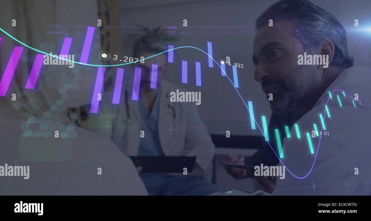 Medical team in scrubs reviewing patient data in hospital meeting room ...