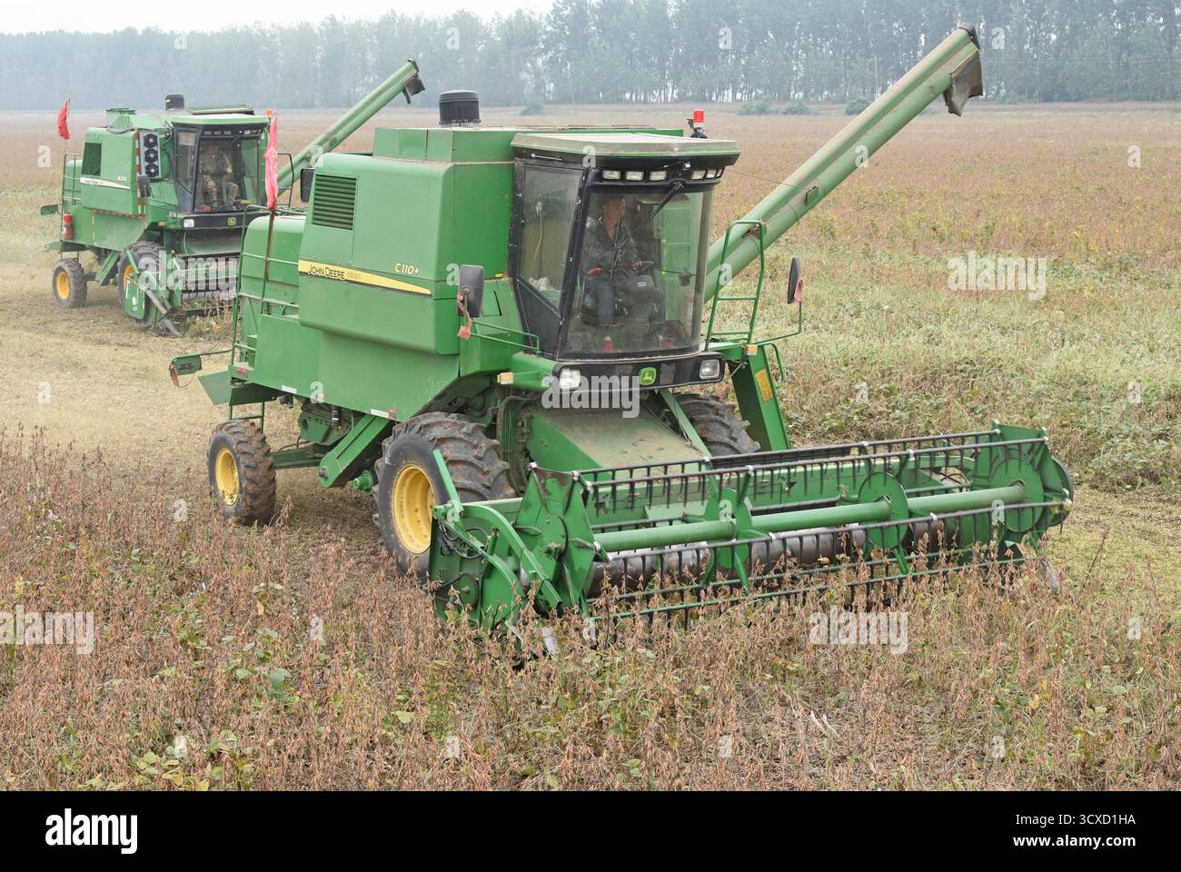 Farmers harvest crops in the field in Huainan City, east China's Anhui ...