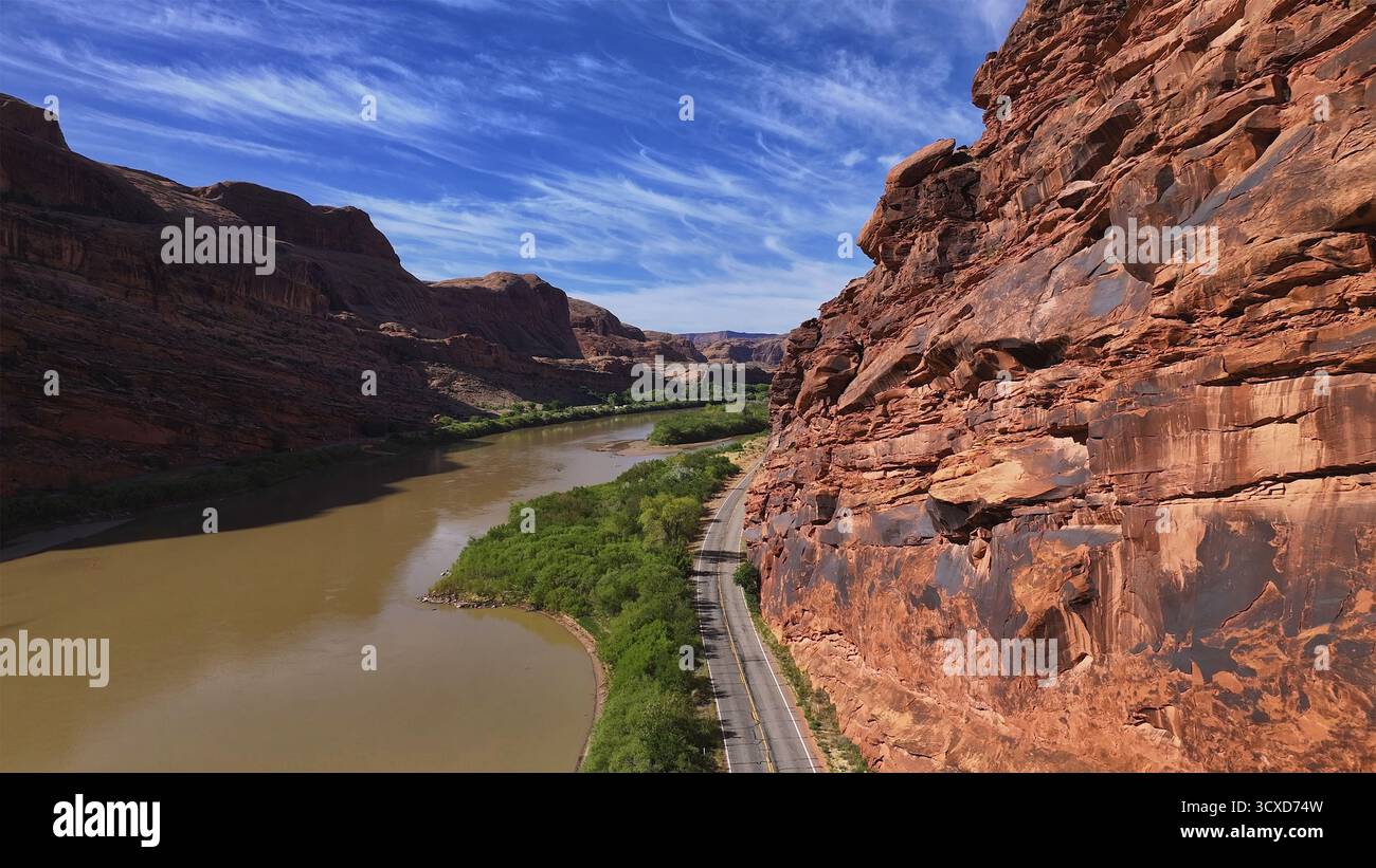 Aerial view of the muddy Colorado River snaking through the red rock ...