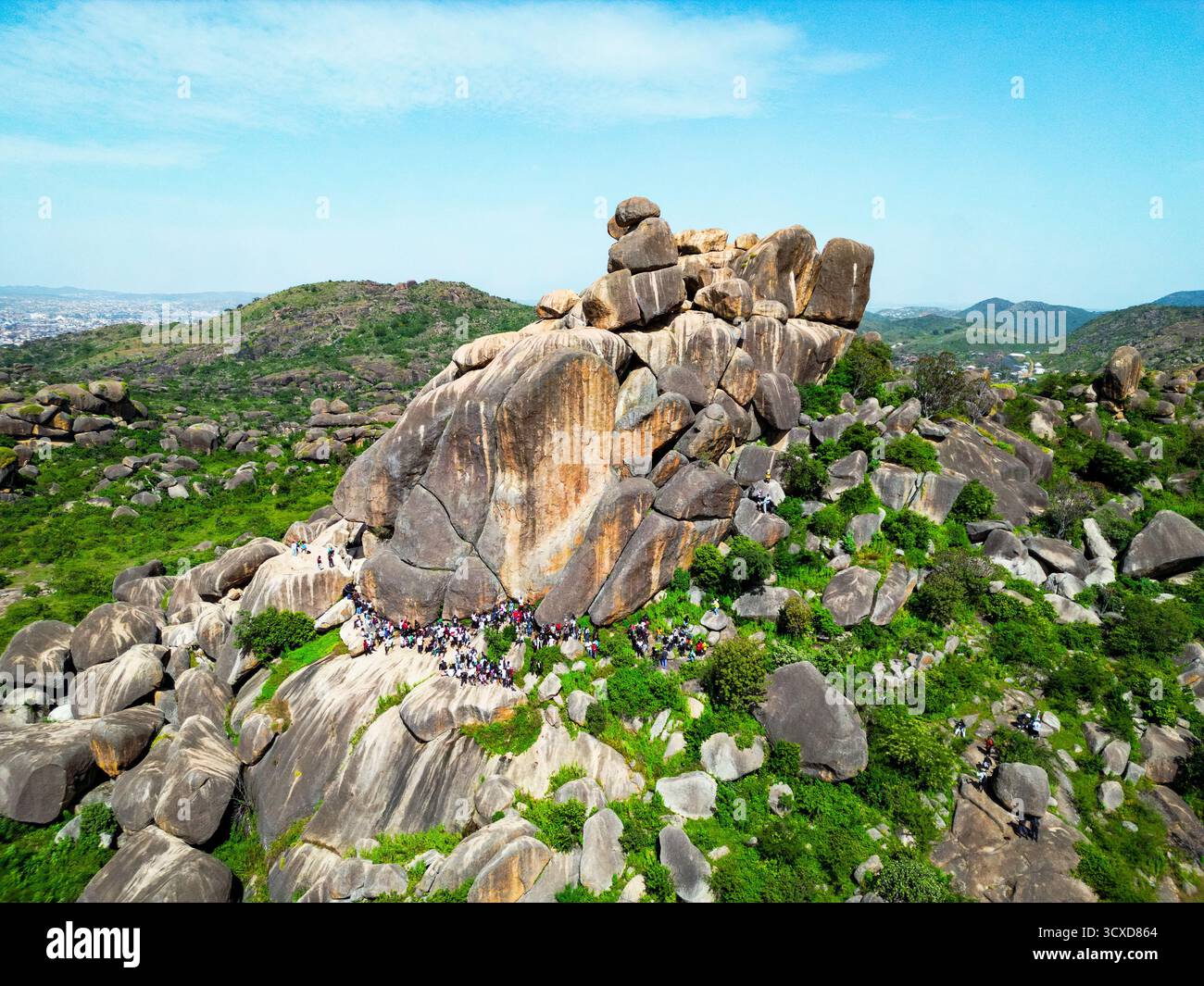 Aerial view of rugged rock formations cascade down the hillside, a ...