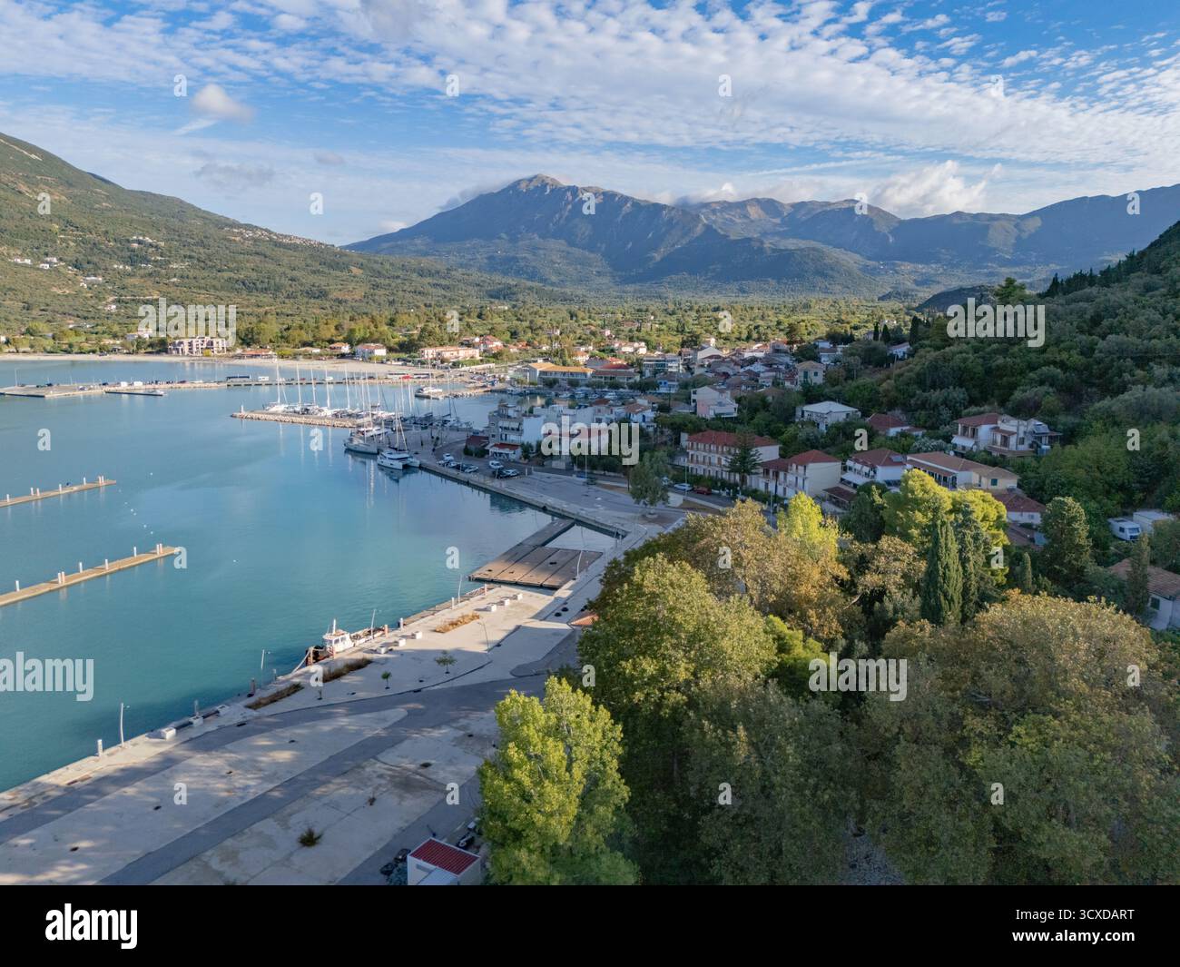 Aerial view of the vibrant harbor meeting the quaint town nestled ...
