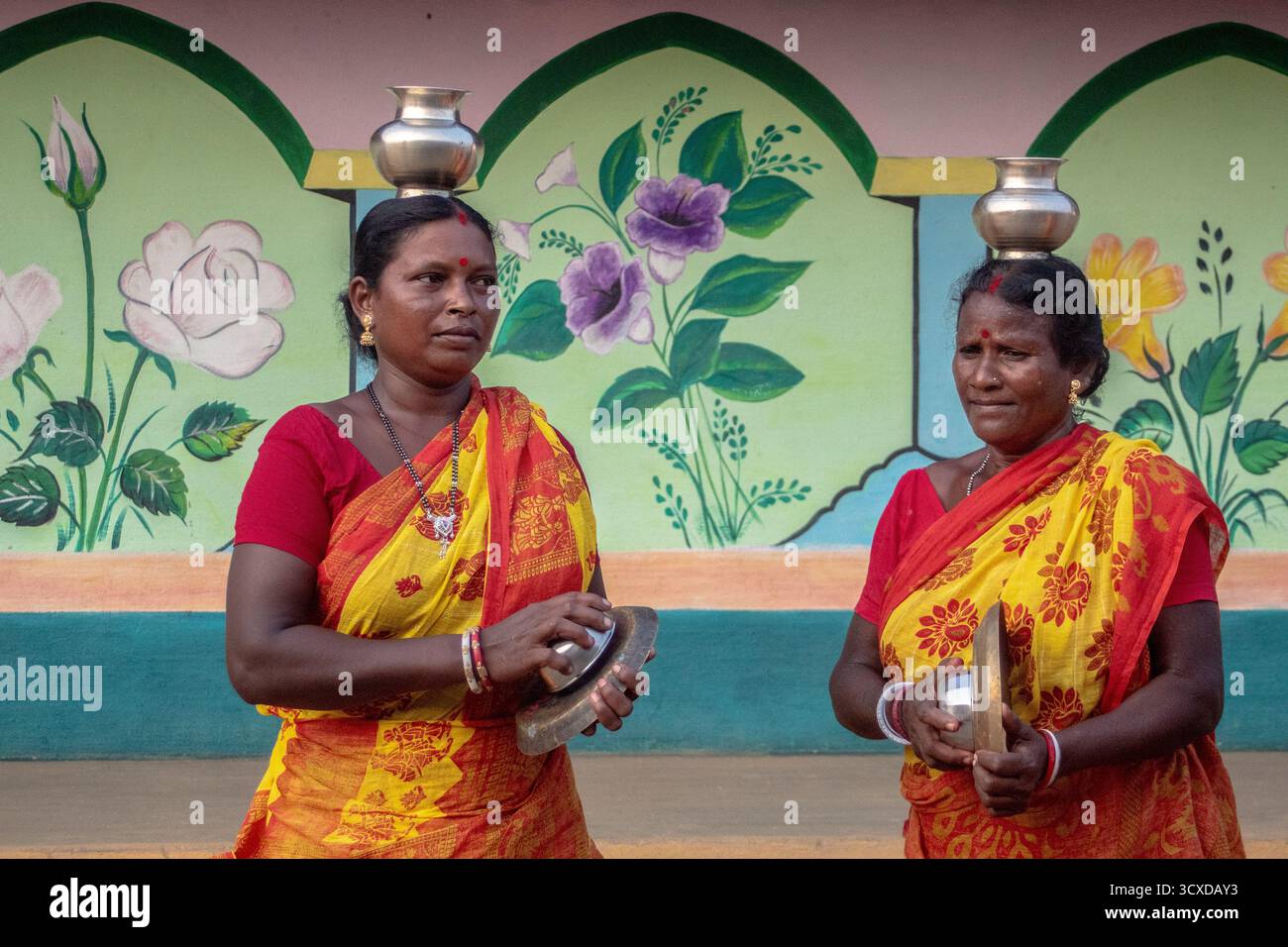 Tribal rural women seen performing a folk dance with utensils during a ...